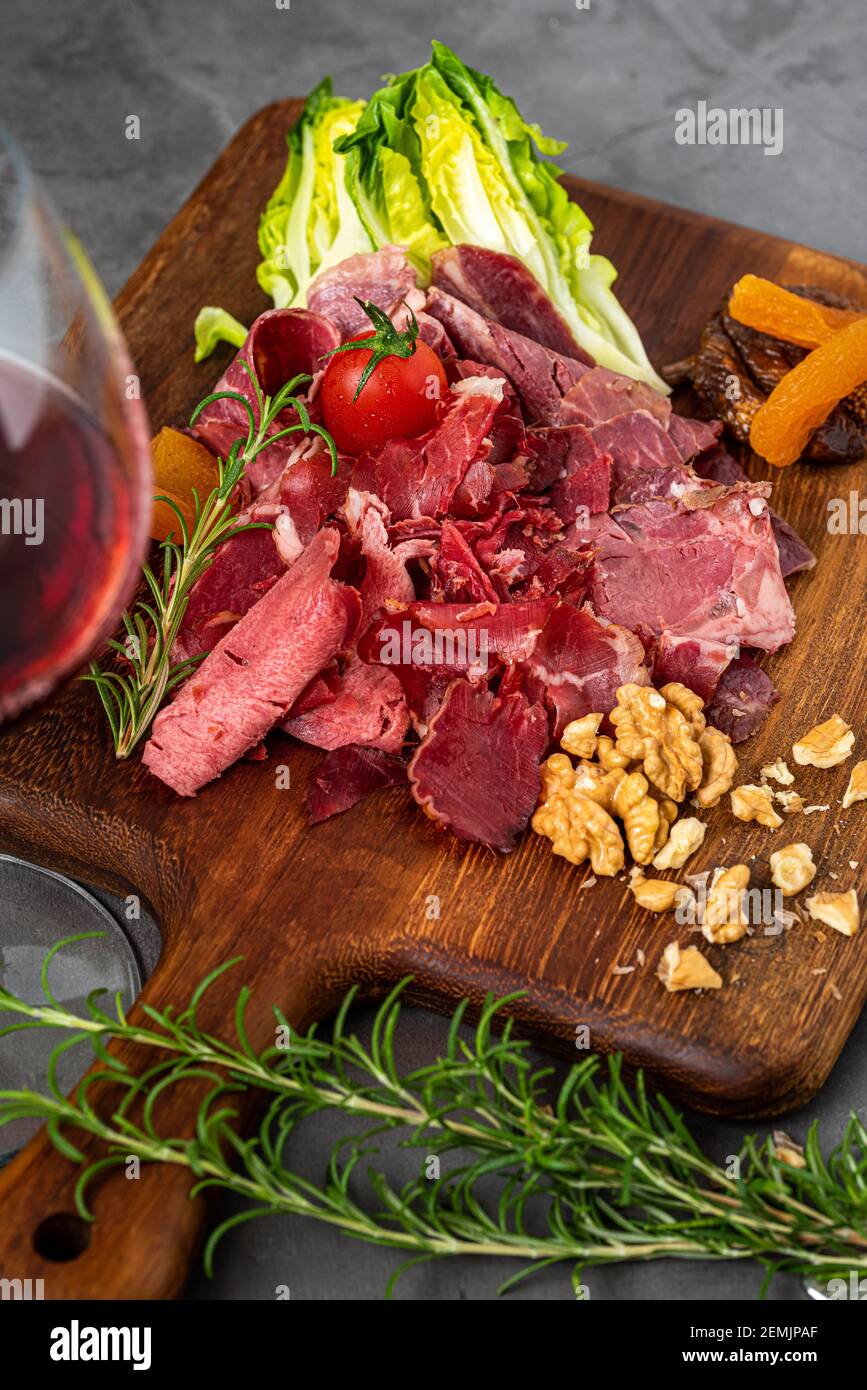 Appetizers table with differents antipasti, grissini, walnut , snacks ...