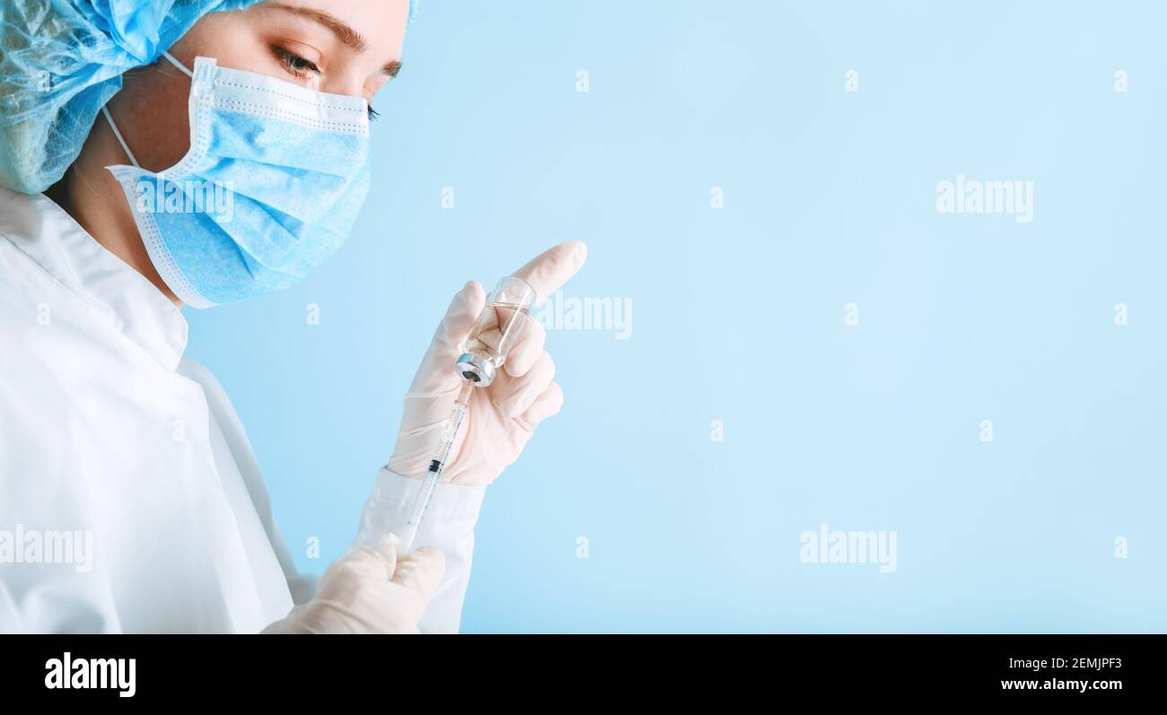 Nurse puts covid 19 vaccine into syringe to give injection. Coronavirus ...