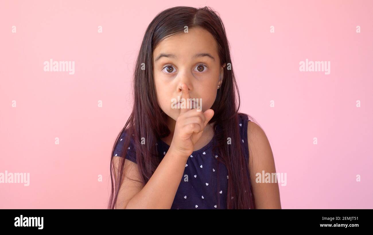 Cute kid girl showing silence hi-res stock photography and images - Alamy