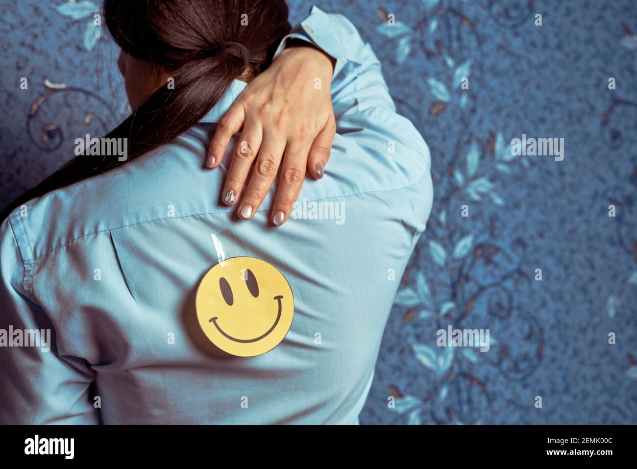 April fools day jokes. A smile sticker on the female back. 1 April ...