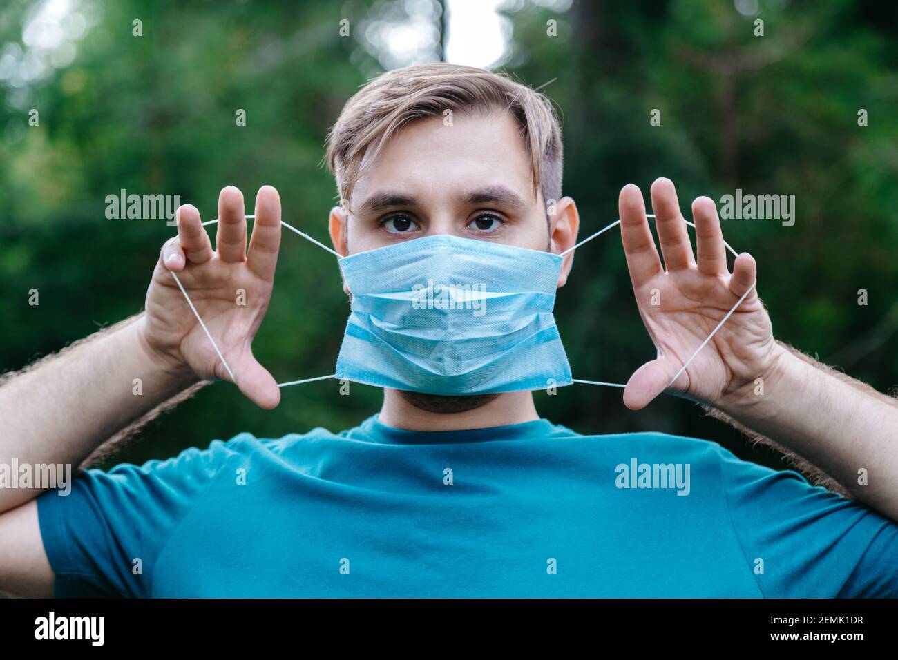 Man holding mask face hi-res stock photography and images - Alamy