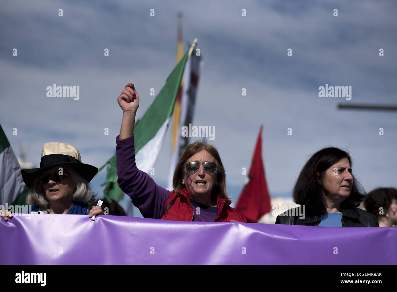 A woman seen demonstrating behind a banner during the strike. Spanish ...