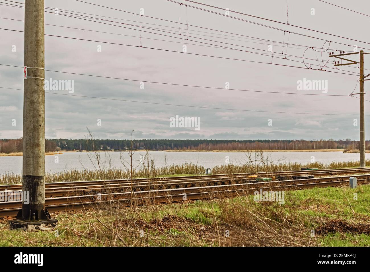 Real railway along river at cloudy day like symbol of relax Stock Photo ...