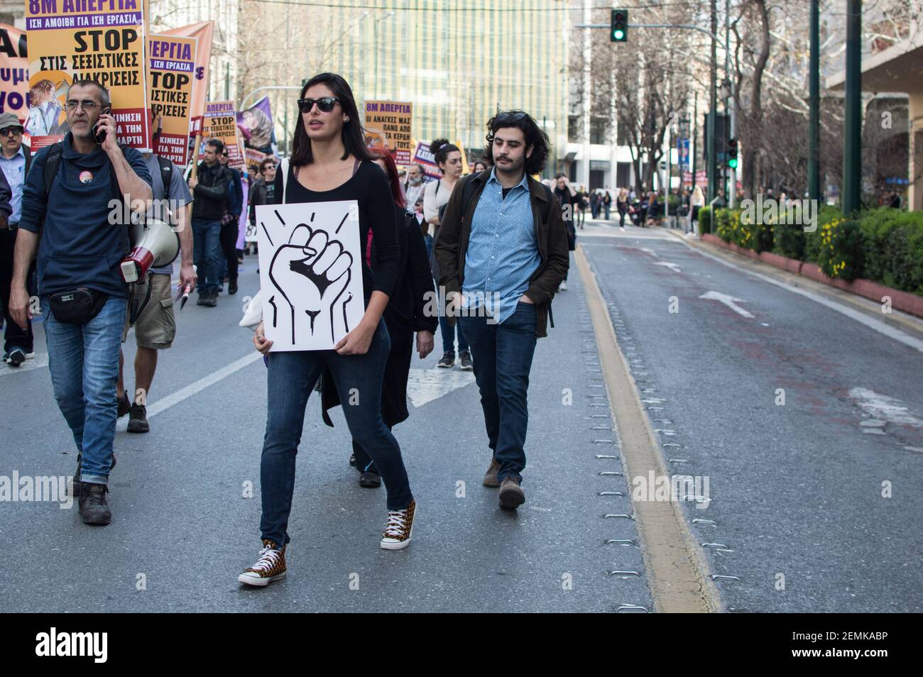 A woman seen with a placard during the protest. Hundreds of people ...