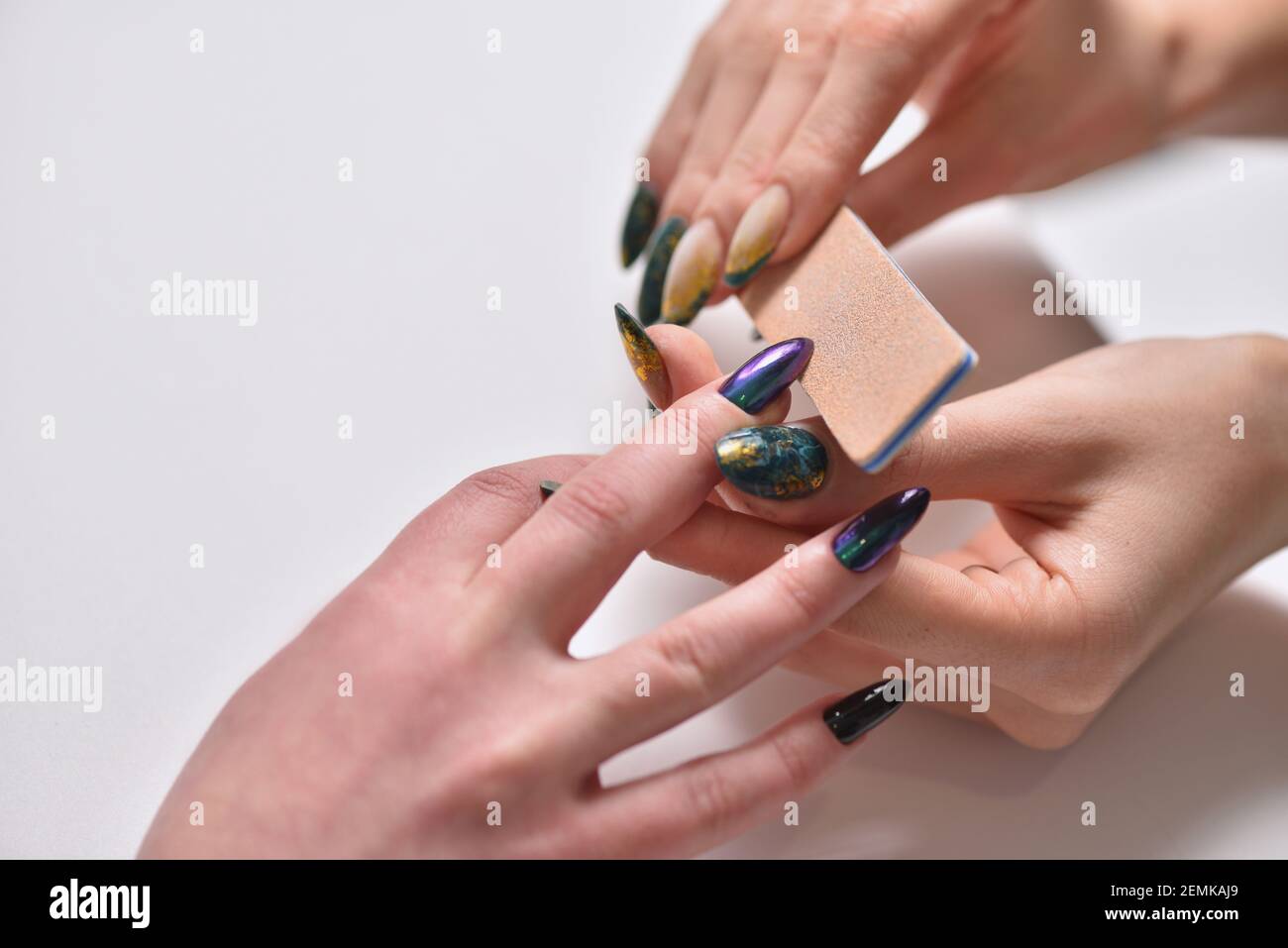 Female hands filing nails hi-res stock photography and images - Alamy
