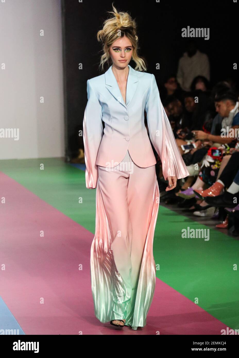 LOS ANGELES, CA, USA - MARCH 08: A model walks the runway at the ...