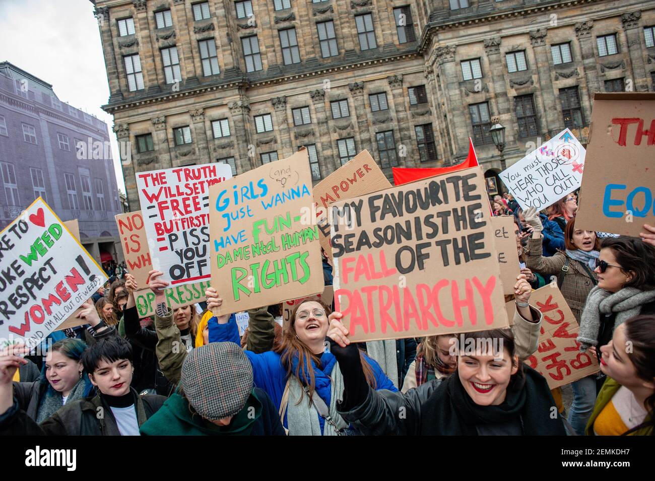 Protesters are seen holding placards during the demonstration. A day ...