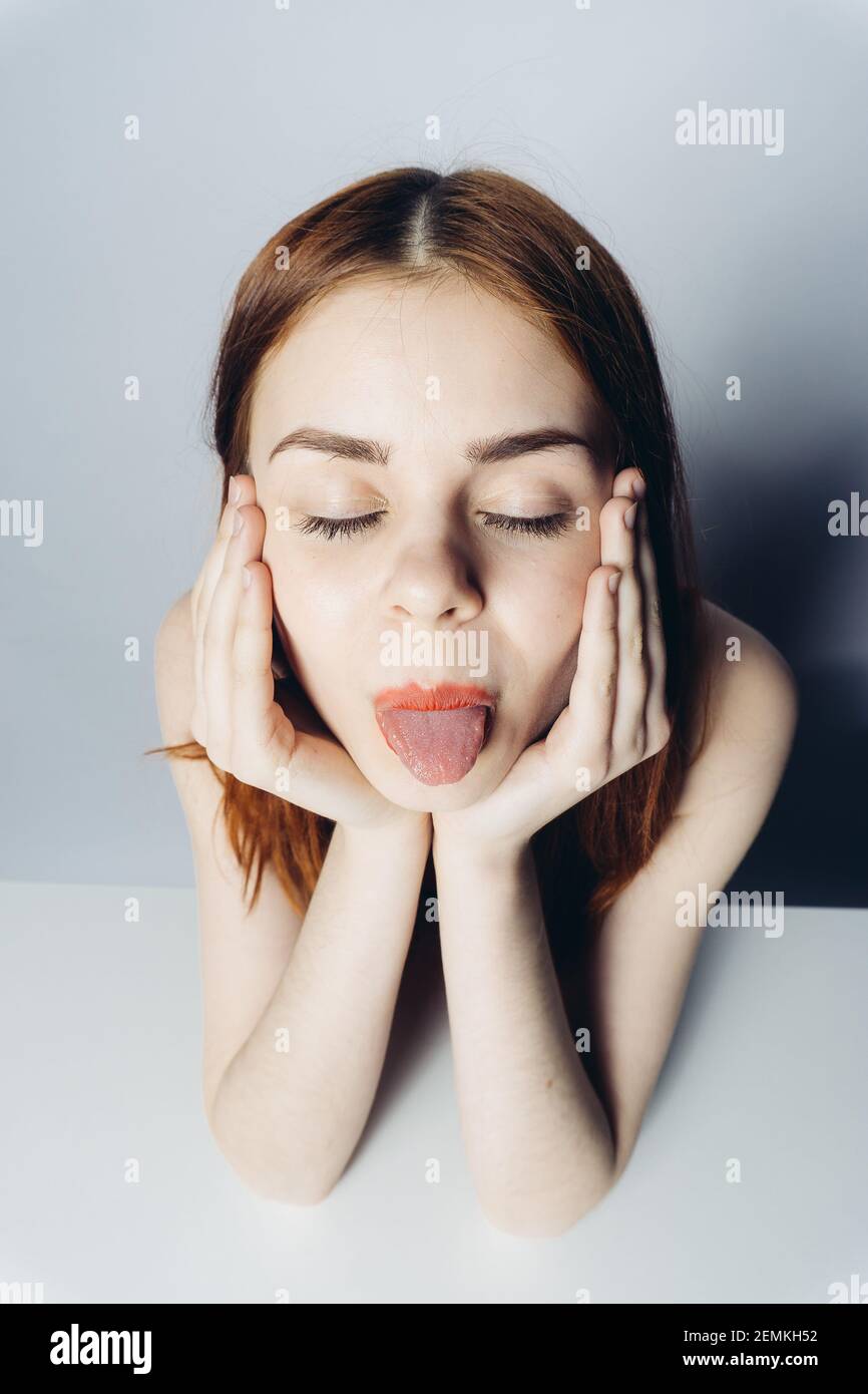 woman with wide open eyes holding hands on face emotions close-up Stock ...