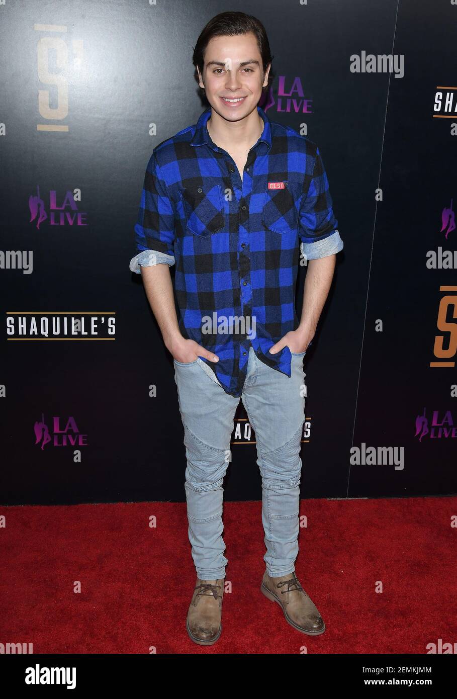 Jake T. Austin arrives at the Grand Opening of SHAQUILLE’S held at L.A ...