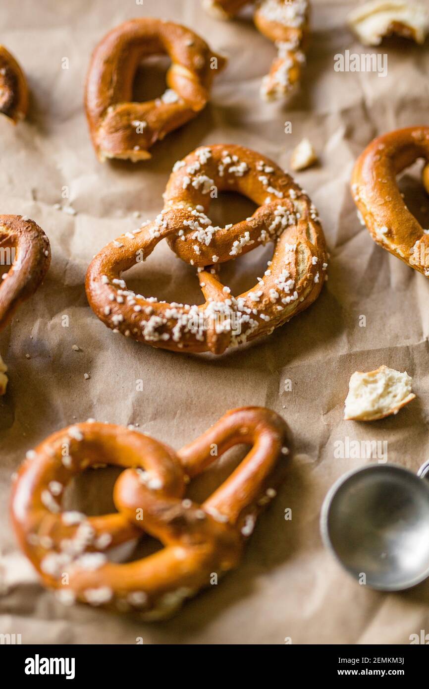 Hard Twisted Pretzel with Salt Against Brown Paper Background Stock ...