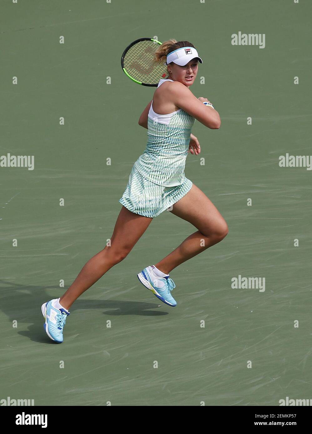 March 10, 2019 Kateryna Kozlova (UKR) returns a shot against Simona ...