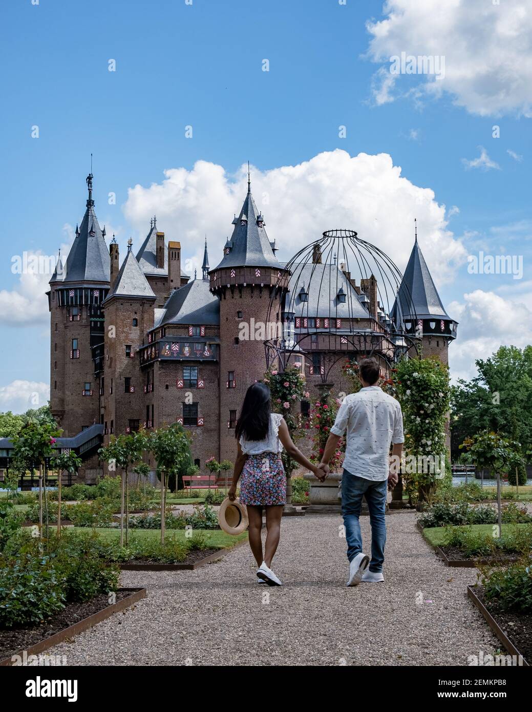 Castle de Haar Utrecht, couple men and woman mid age European and Asian ...