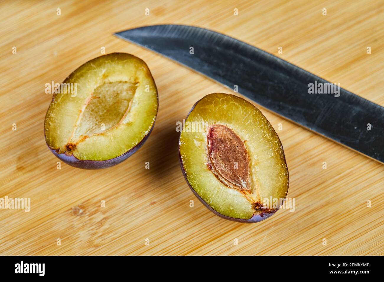 Half of the plum hi-res stock photography and images - Alamy