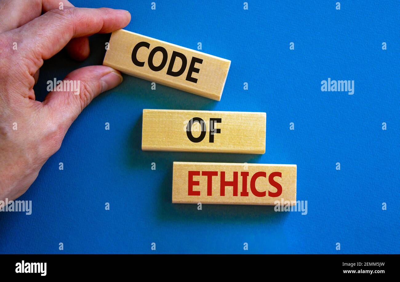 Code of ethics symbol. Concept words 'Code of ethics' on wooden blocks ...