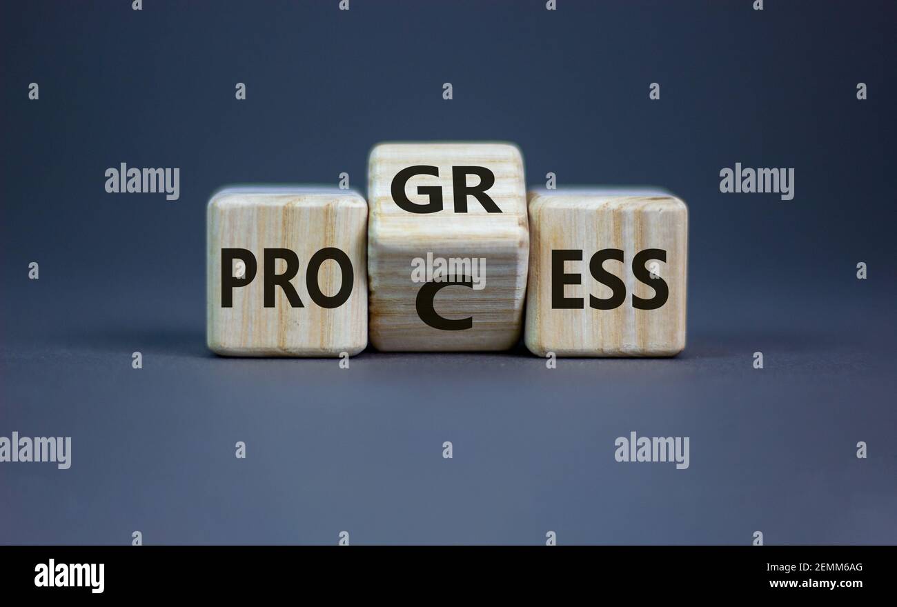 Process and progress symbol. Turned a wooden cube and changed the word ...