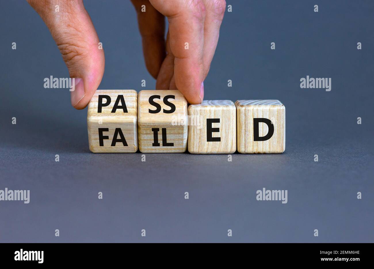 Passed or failed symbol. Businessman turns wooden cubes and changes the ...
