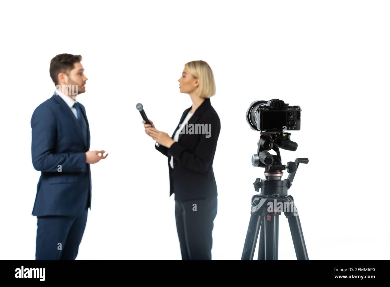 side view of businessman talking during interview with blonde ...