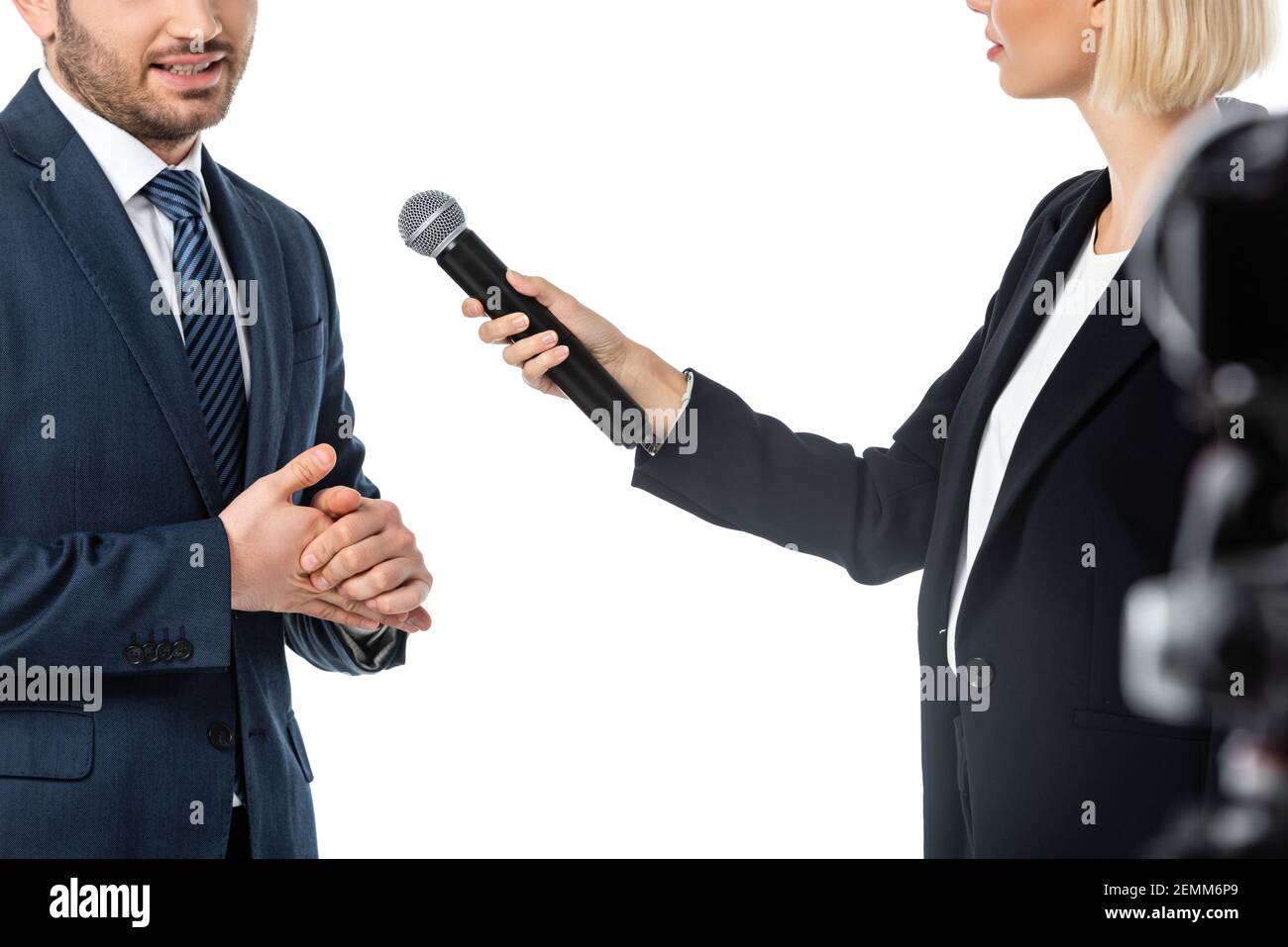 partial view of news presenter taking interview from businessman ...