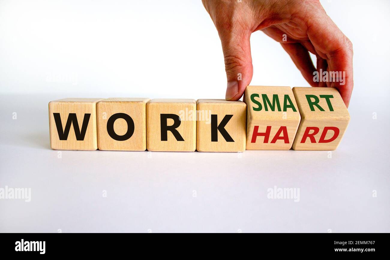 Work hard or smart symbol. Businessman turns wooden cubes and changes ...