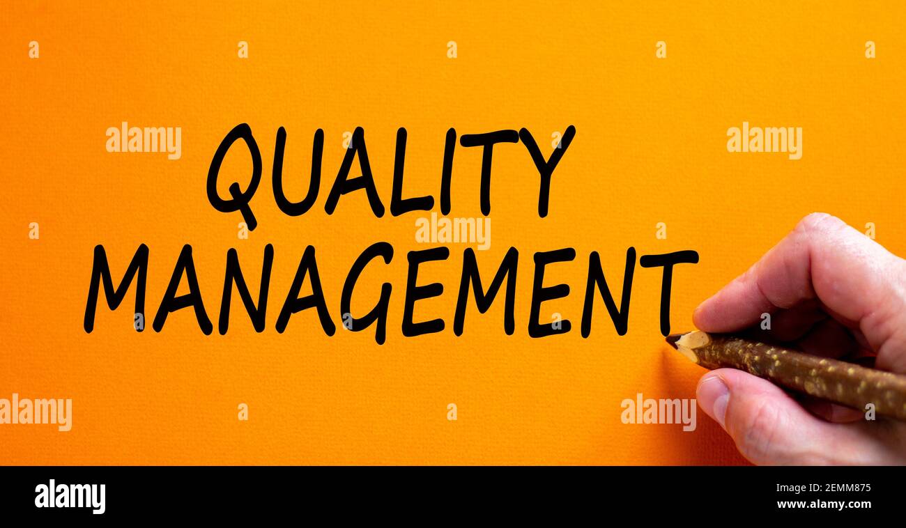 Quality management symbol. Businessman writing words 'Quality ...