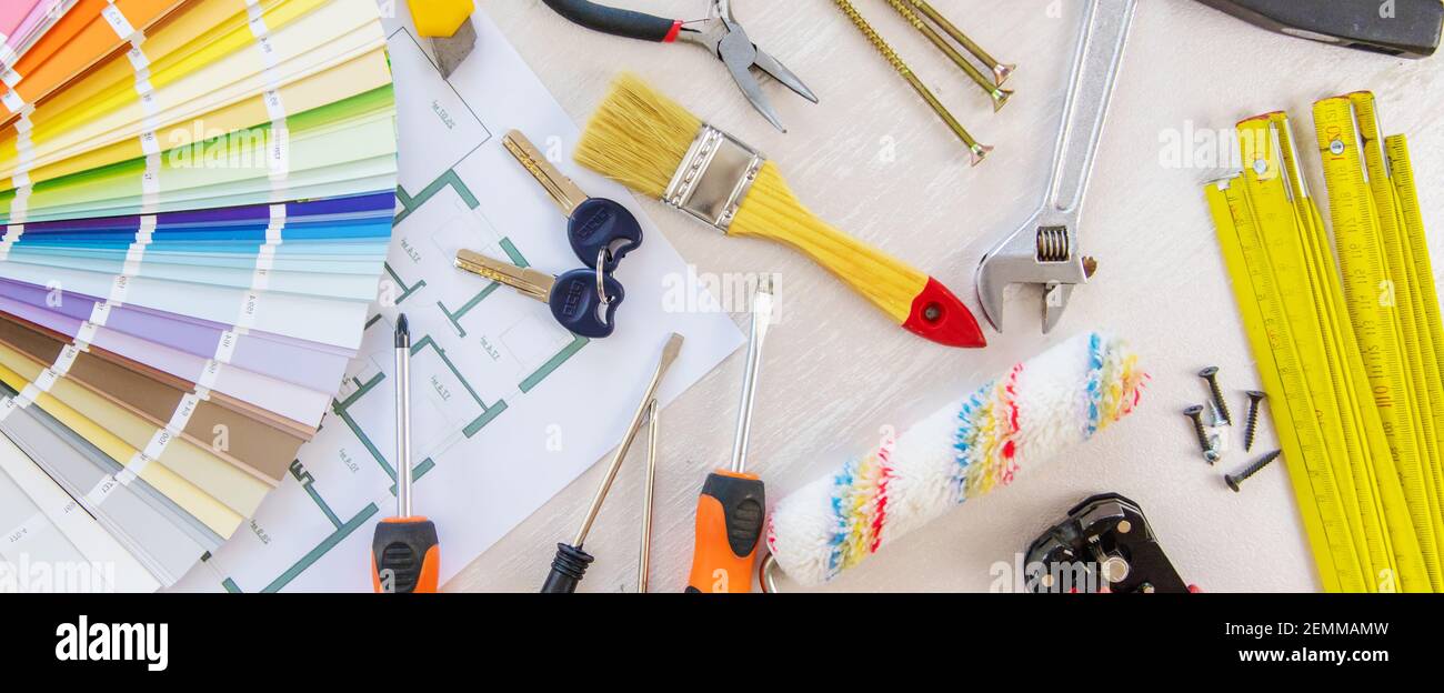 home improvement and renovation concept - construction tools and items ...