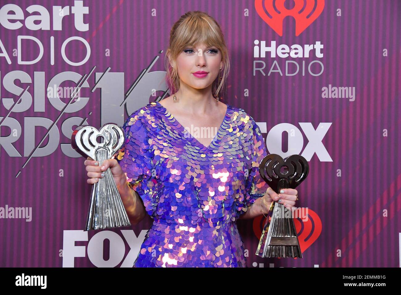 Taylor Swift poses in the press room during the 2019 iHeartRadio Music ...