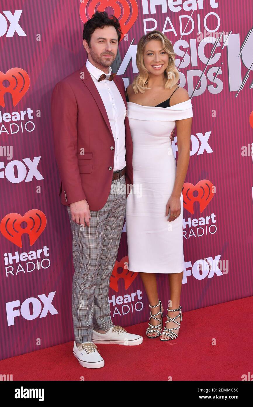 Beau Clark and Stassi Schroeder at the 2019 iHeartRadio Music Awards ...