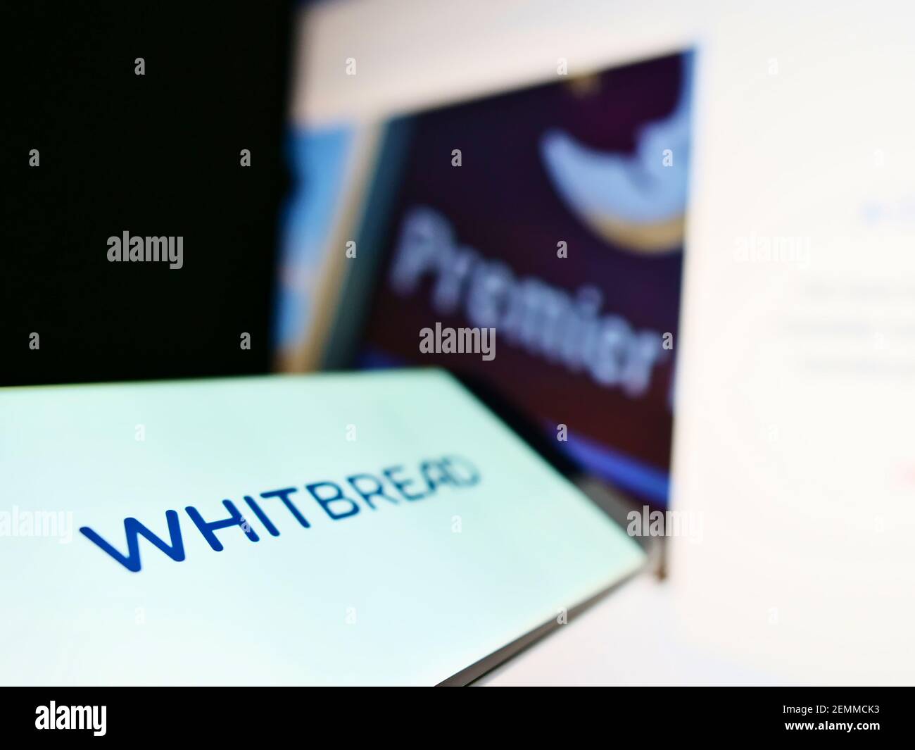 Mobile phone with business logo of British hospitality company ...