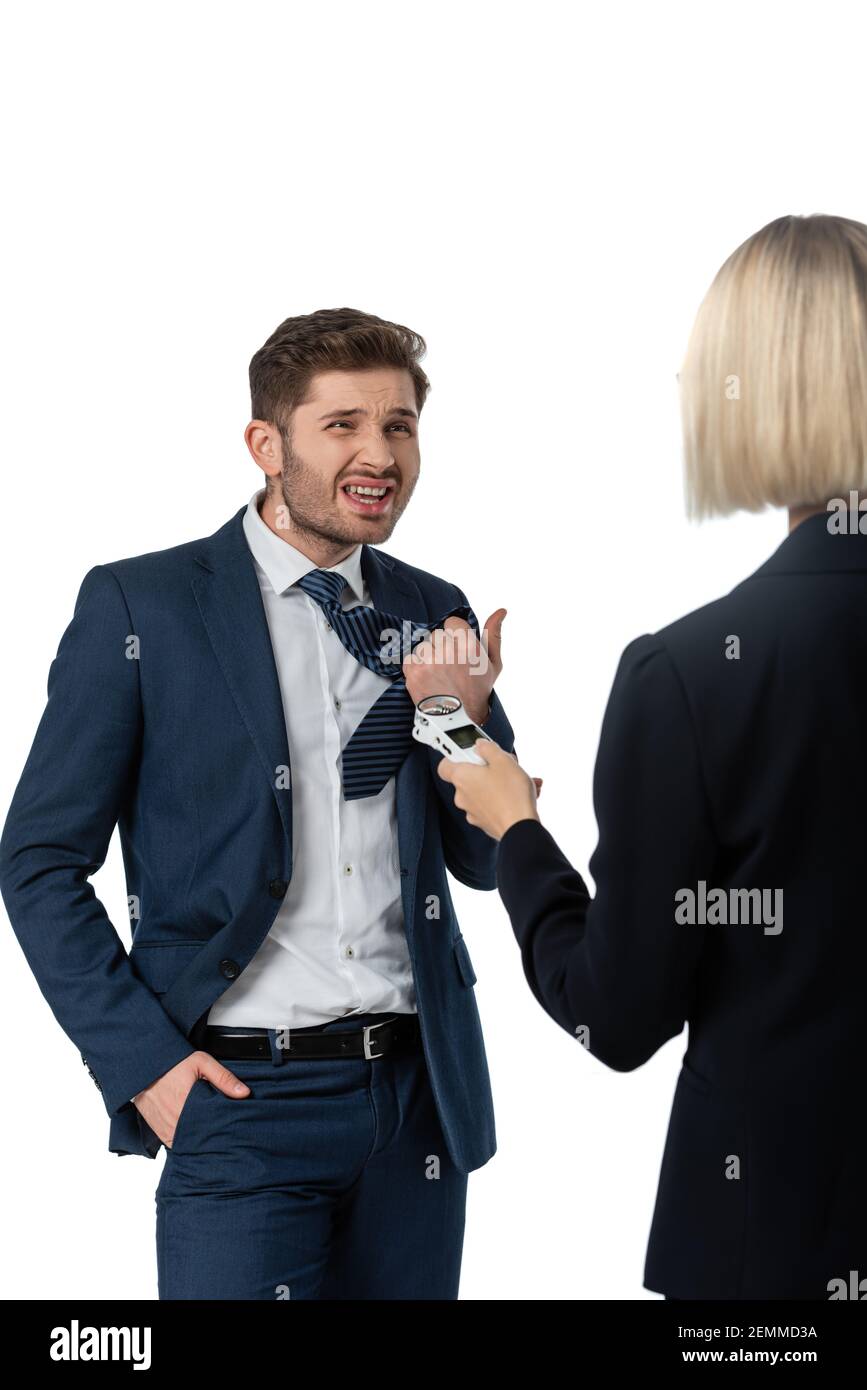 irritated businessman screaming during interview with blonde journalist ...