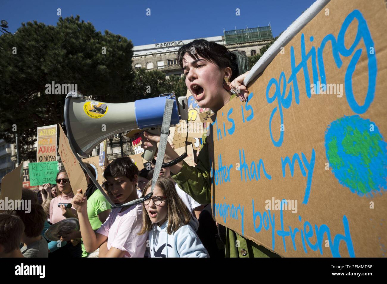 A woman seen shouting on a megaphone during the protest. Students stage ...