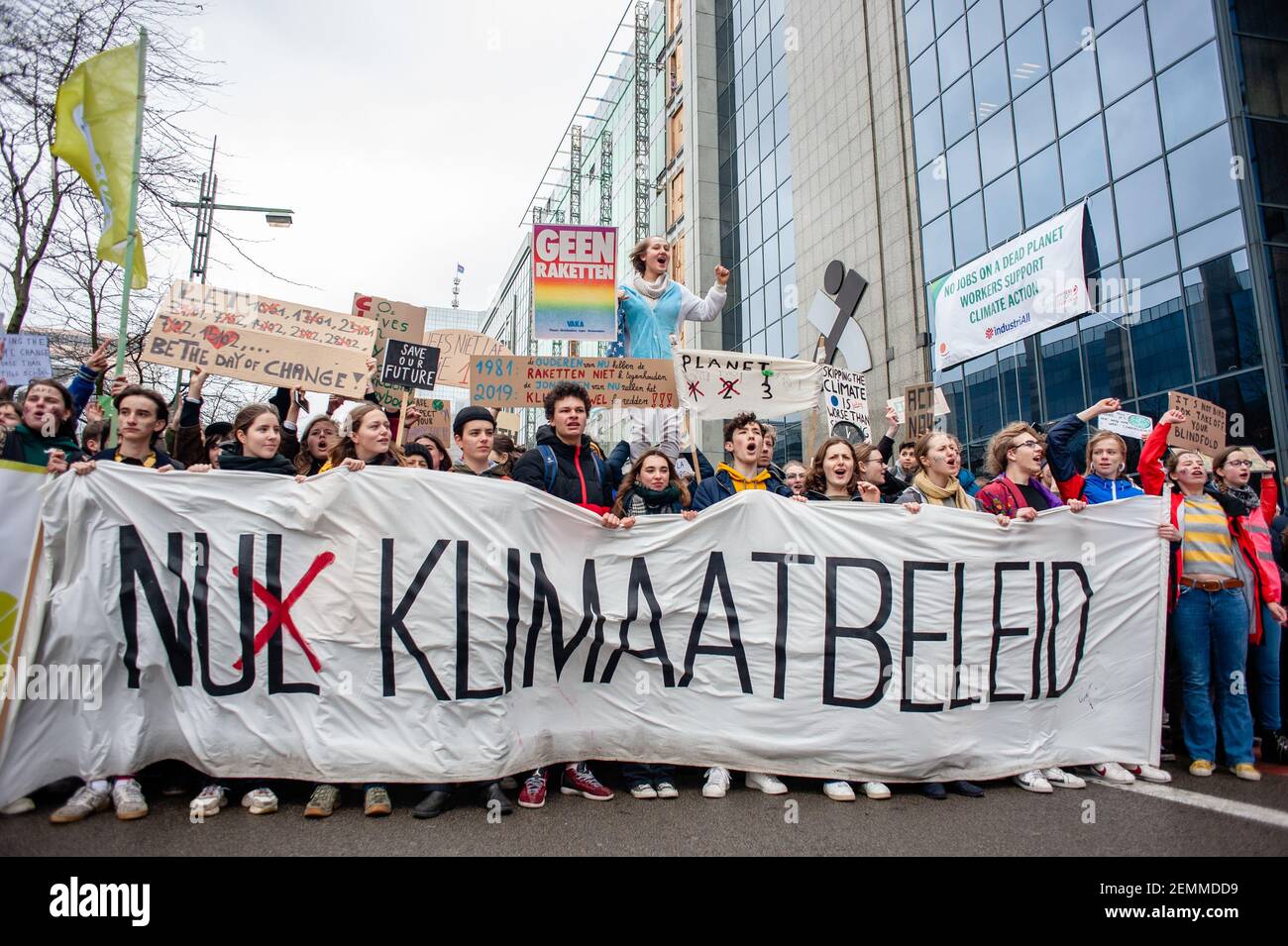 People are seen screaming slogans behind the principal banner during ...