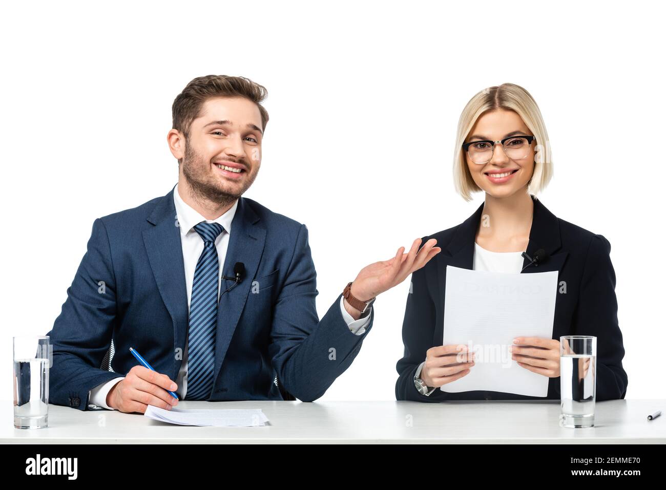 happy news anchor pointing at smiling colleague holding paper at ...