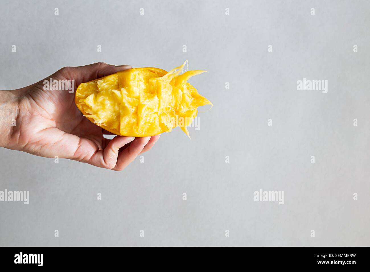 Woman eating mango hi-res stock photography and images - Alamy