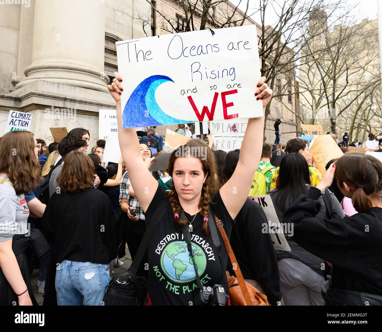 A girl seen holding a placard during the Youth Climate Strike protest ...