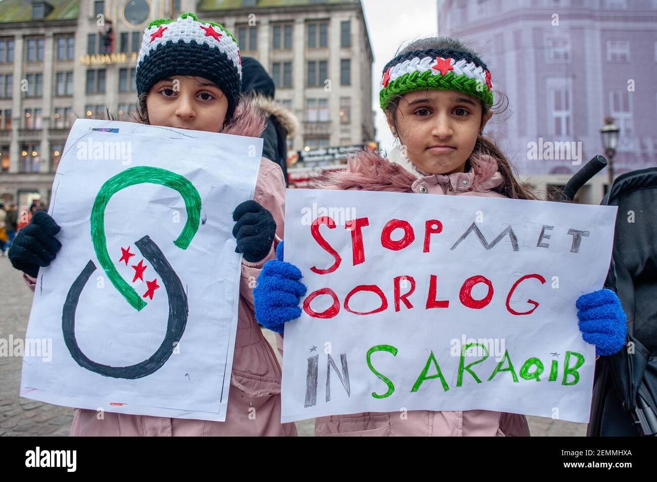 Two little Syrian girls are holding placards during the demonstration ...