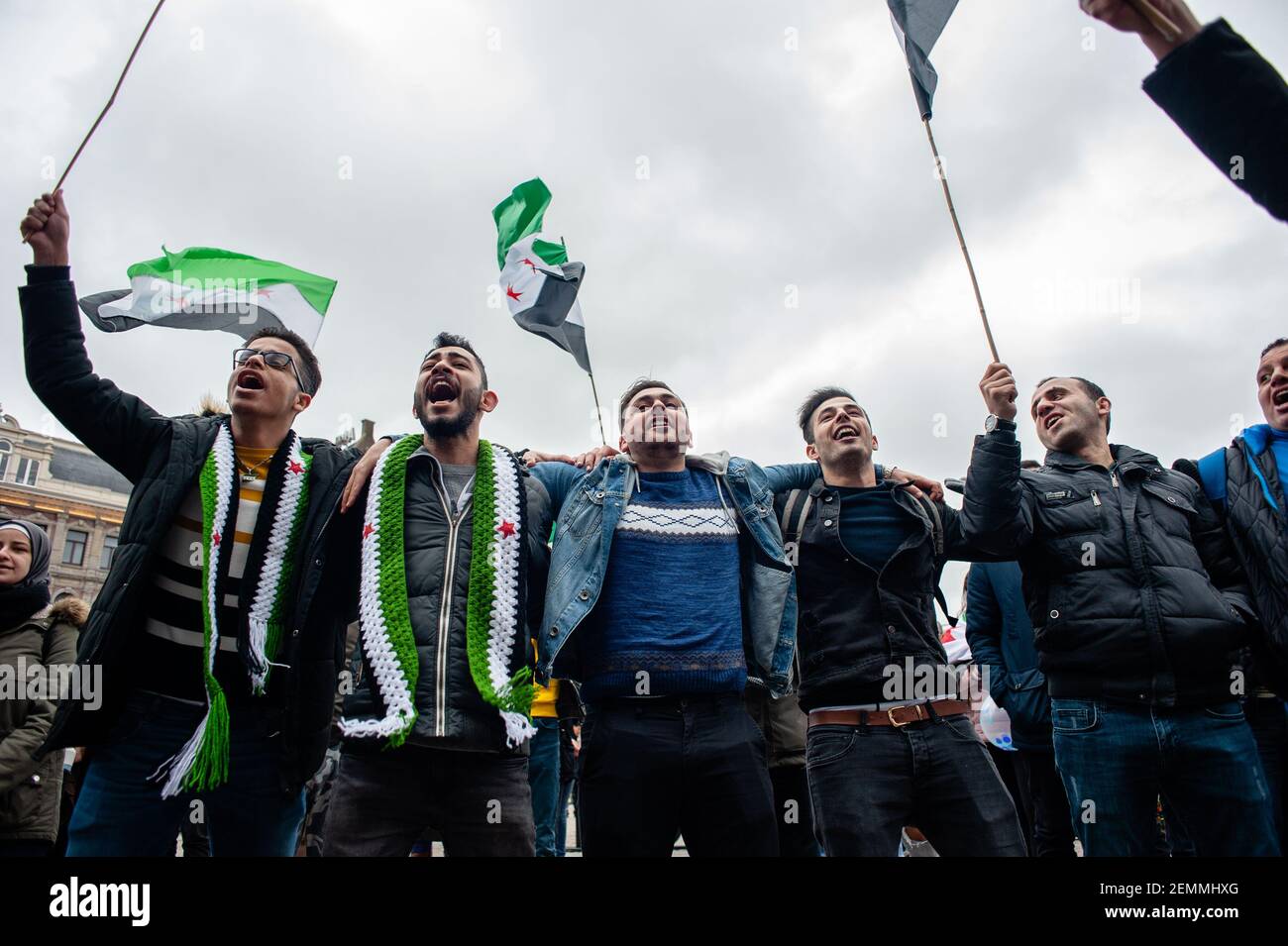 A group of men are dancing Syrian songs during the demonstration Eight ...