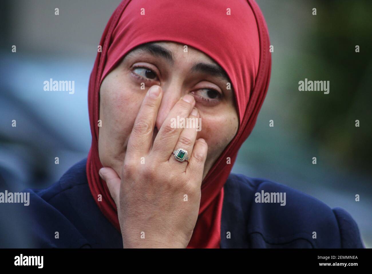 A woman seen crying while talking to media about the Christchurch ...