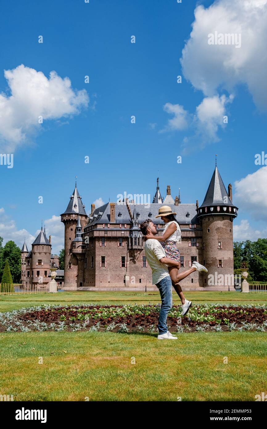 Castle de Haar Utrecht, couple men and woman mid age European and Asian ...