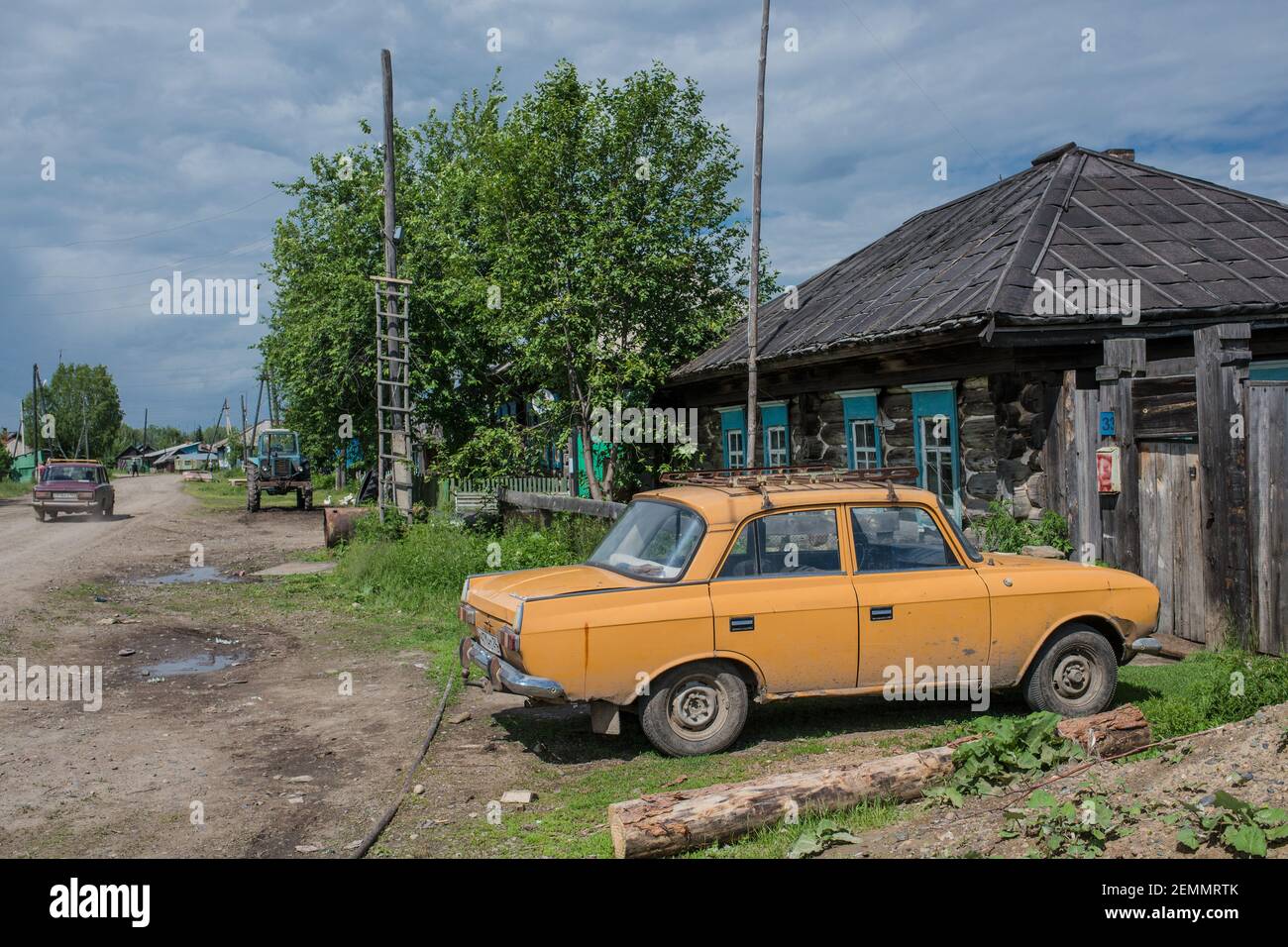 Retro soviet yellow car in the Siberian outback. The village of Bolshoy ...
