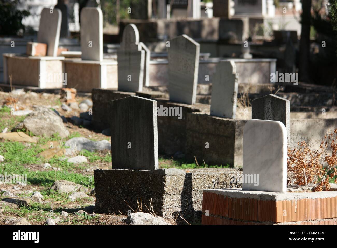 Tombstone and graves in an ancient Muslim graveyard Stock Photo - Alamy