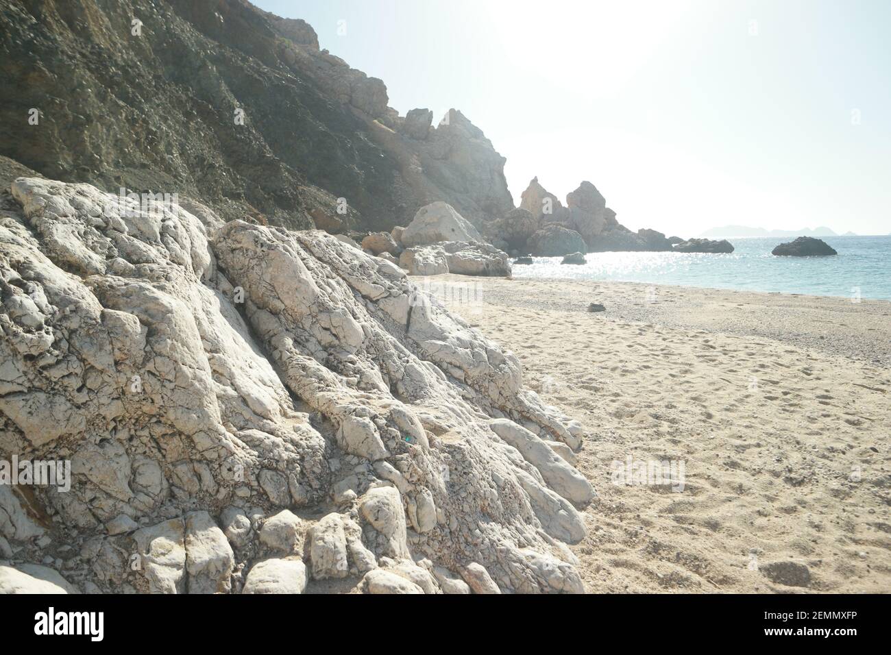 Rocky beach with a view of rock and sea Stock Photo - Alamy