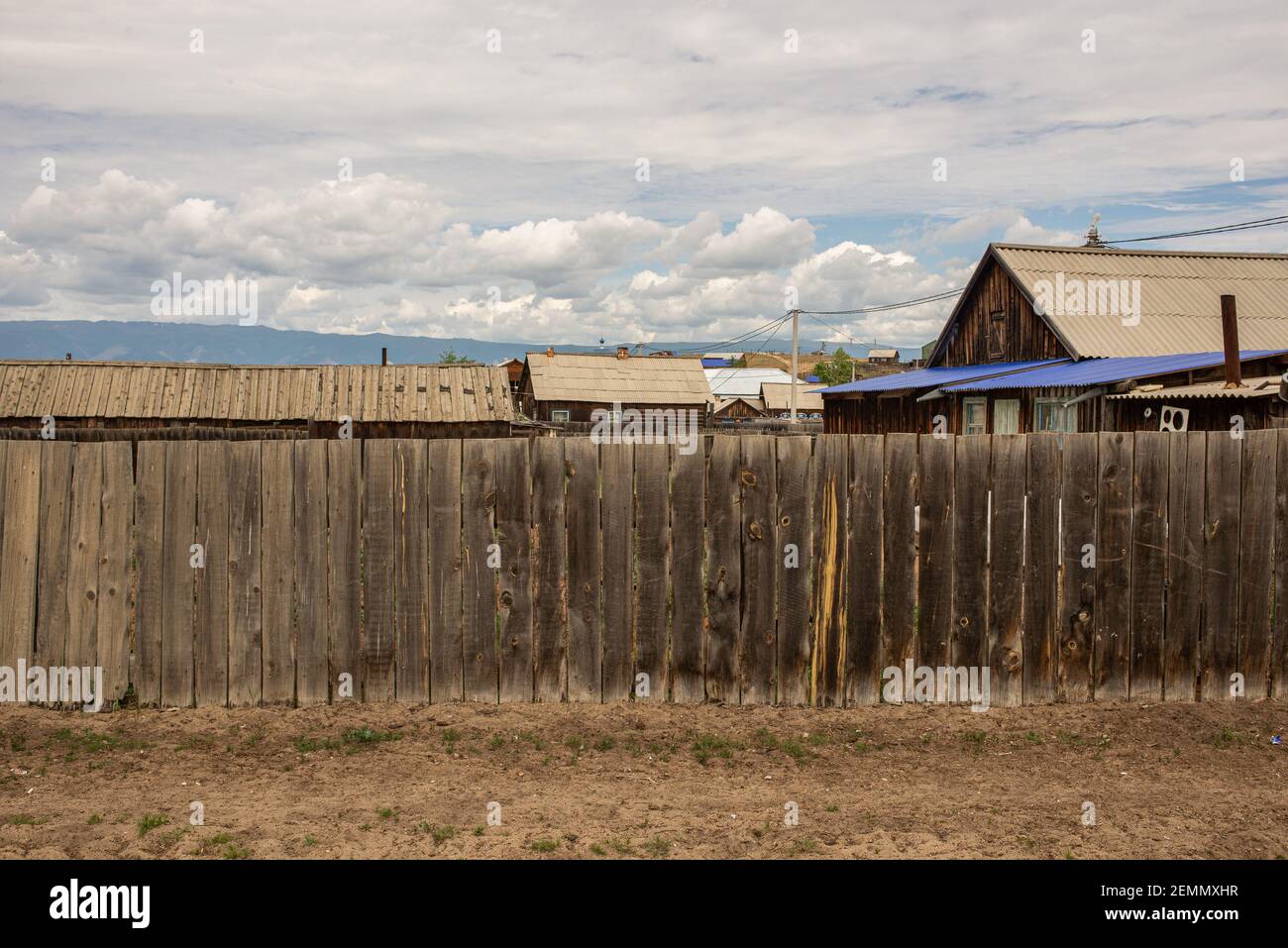 Wooden fence, traditional for the Russian hinterland in Khuzhir, main ...