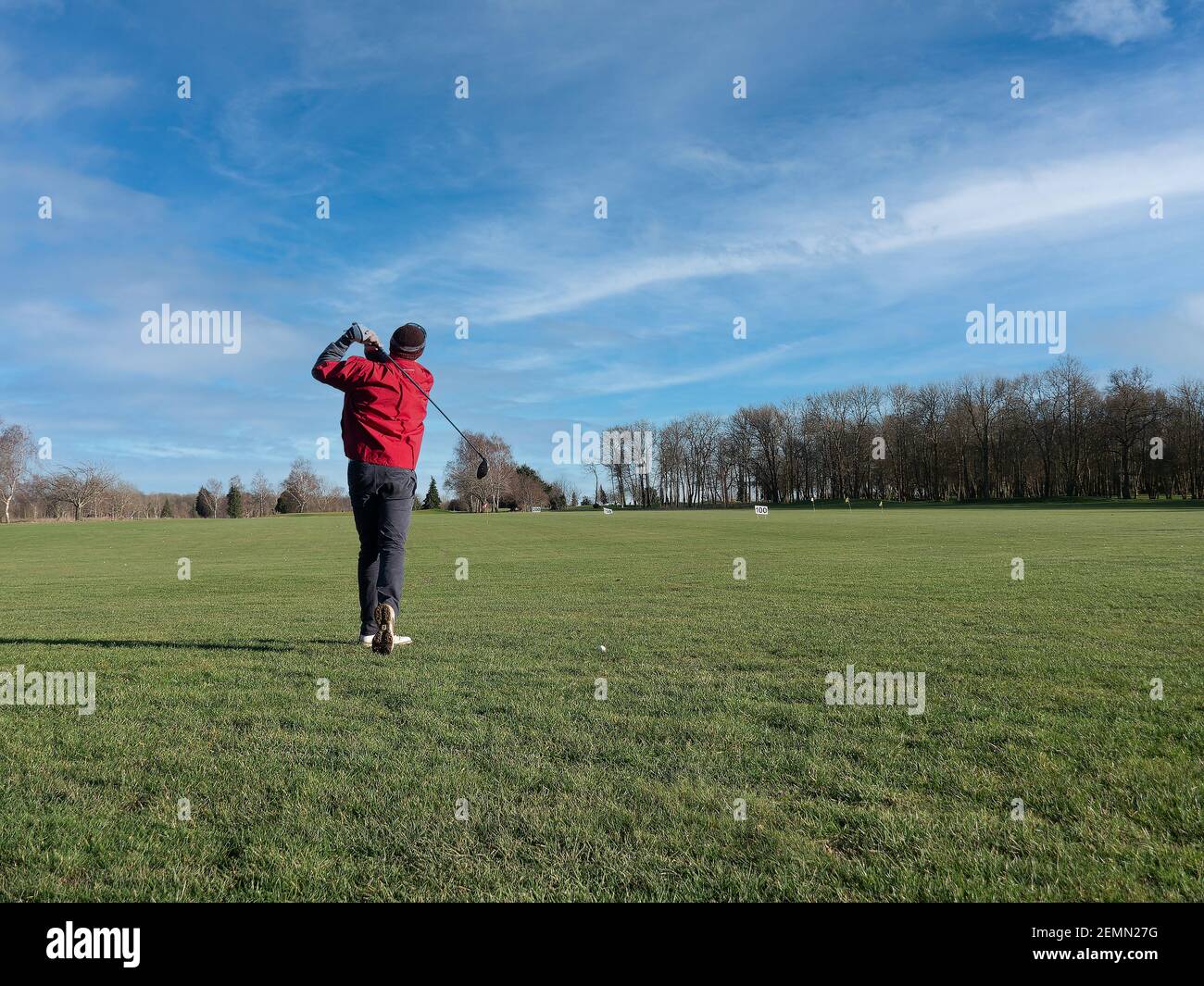 Caen, France, February 2021. A golf course and a player practicing long ...