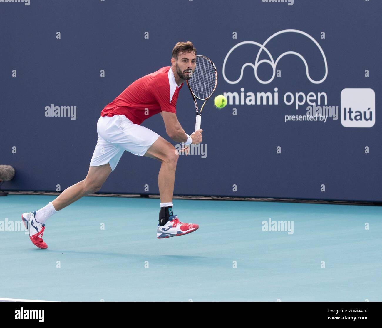 Marcel Granollers of Spain returns a backhand against Zane Khan of ...