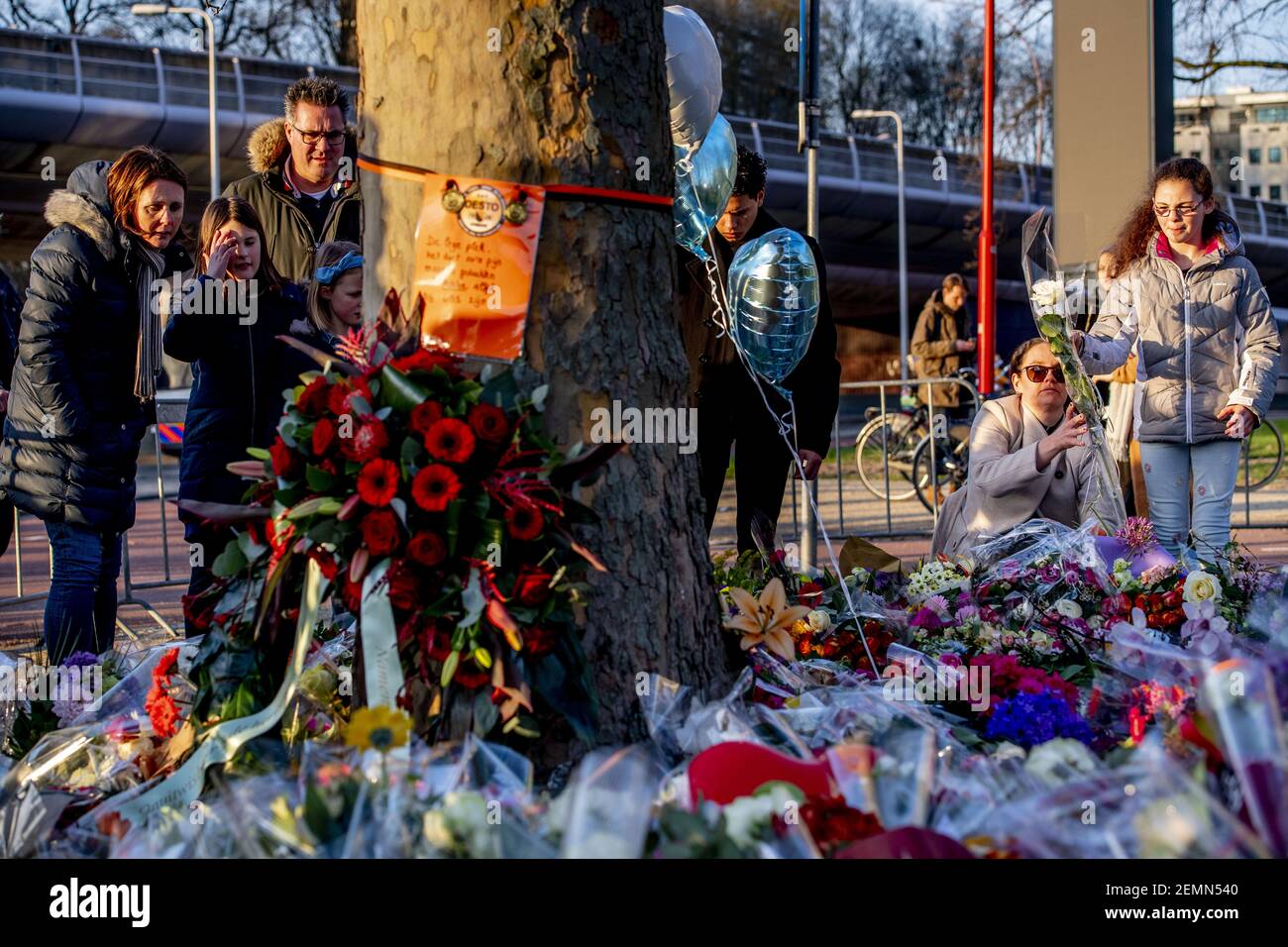 Visitors place floral tributes near the scene of the fatal shooting at ...
