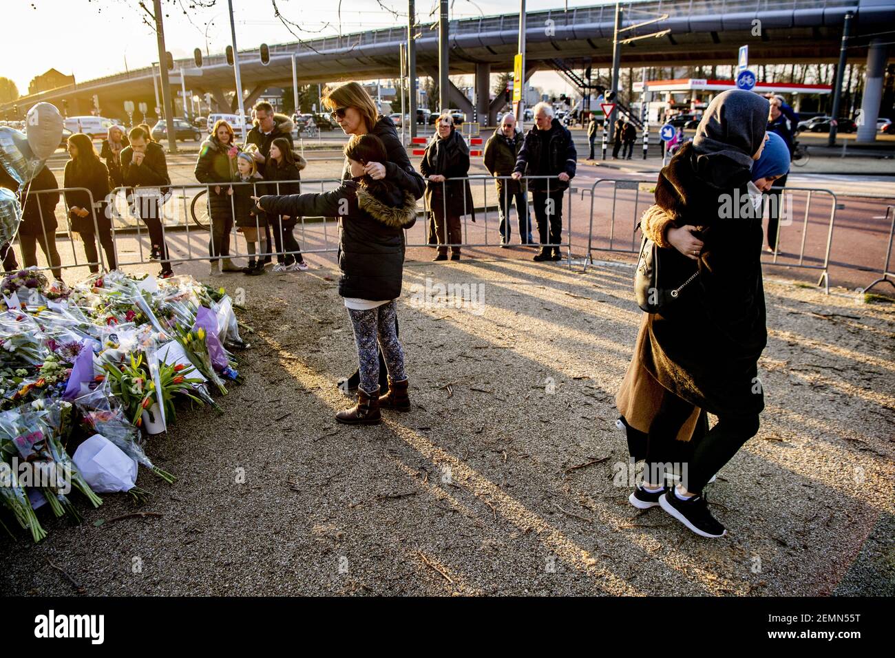 Visitors place floral tributes near the scene of the fatal shooting at ...