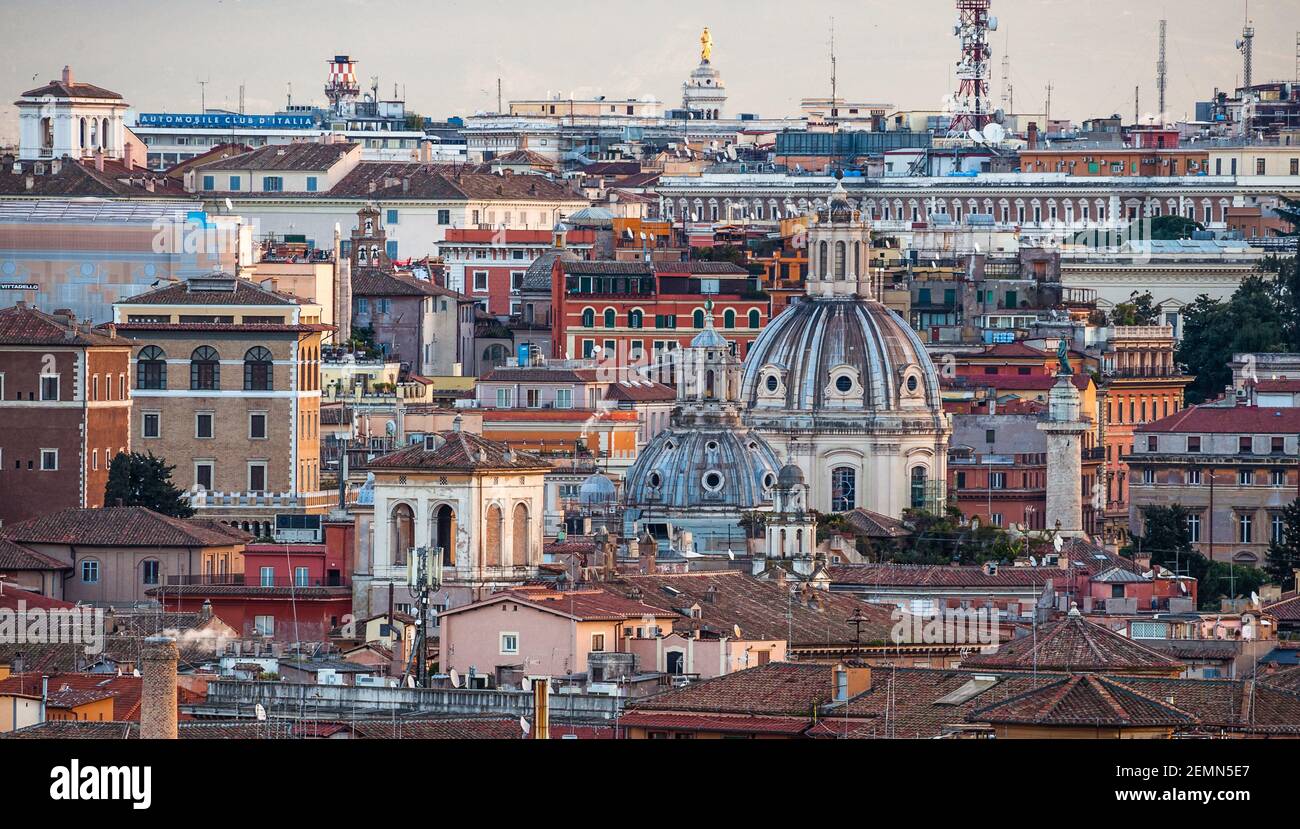 Domes of churches and roofs of houses in Rome at sunrise Stock Photo ...