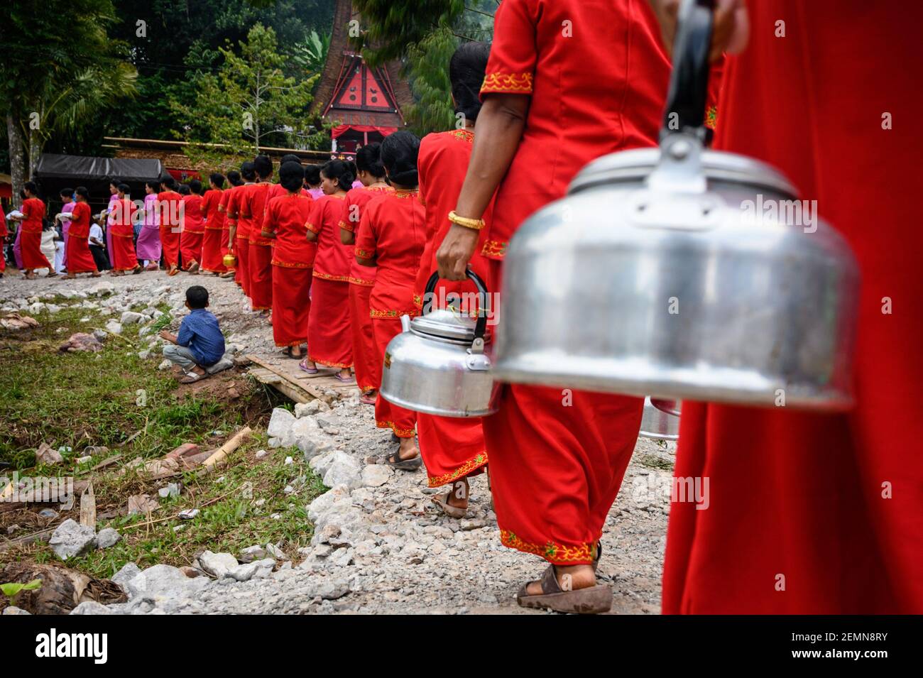 Residents wearing traditional clothes are seen performing rituals ...