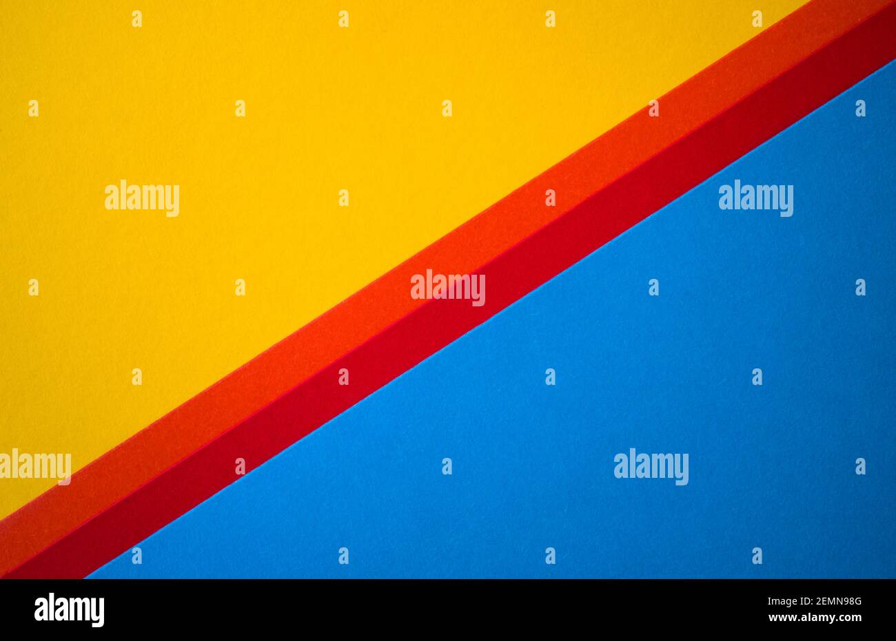 Yellow and blue colored paper background divided diagonally Stock Photo ...