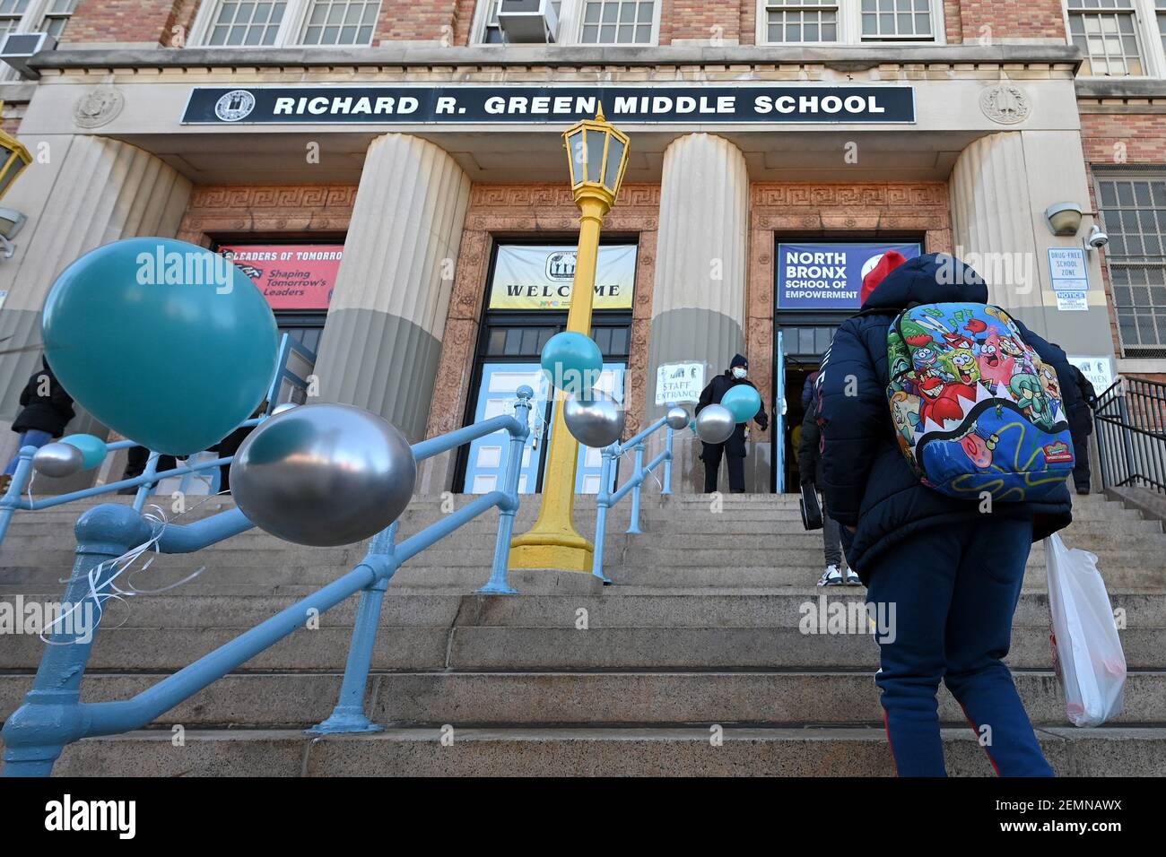 A returning student climbs the steps at Richard R. Green Middle School ...